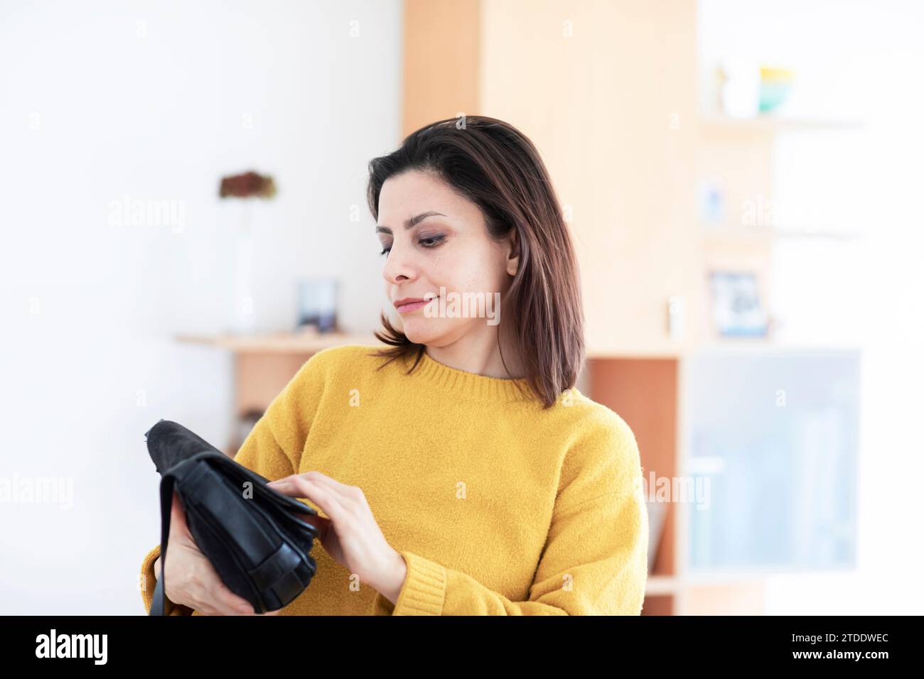 woman middle old opening a bag at home Stock Photo - Alamy