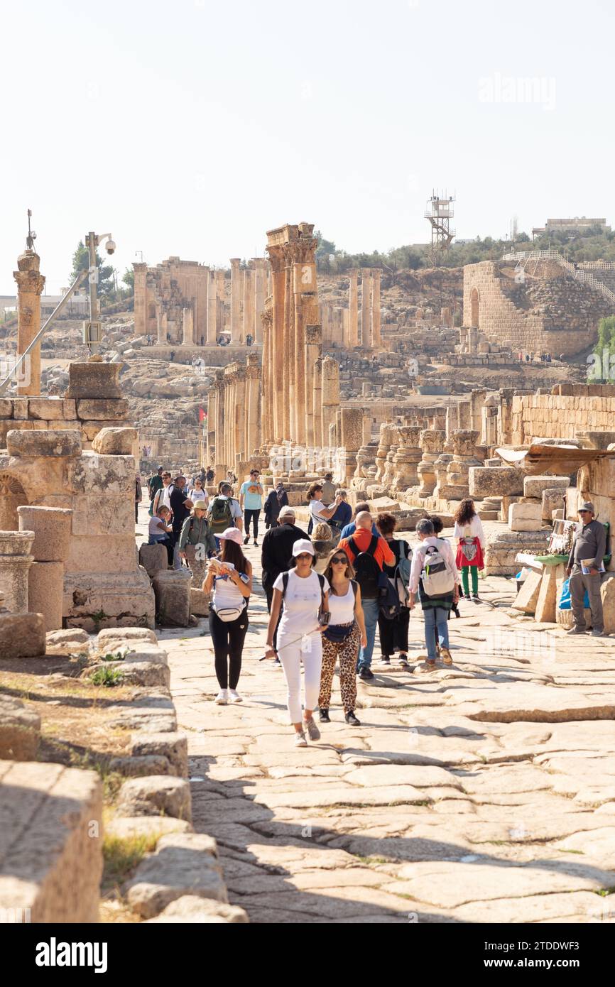 Tourists visiting the Jerash ruins during sunny day, Jordan Stock Photo ...