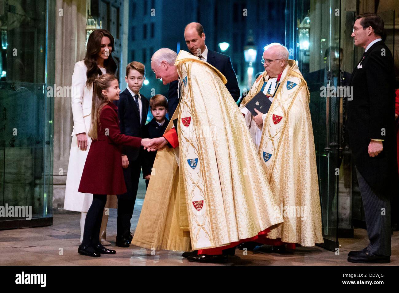 Britain's Princess Charlotte, shakes hands with the Reverend David ...