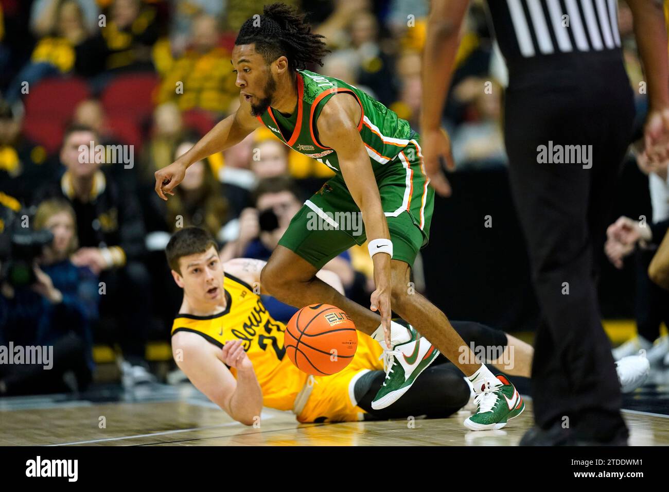 Florida A&M guard Hantz Louis-Jeune drives past Iowa forward Patrick ...