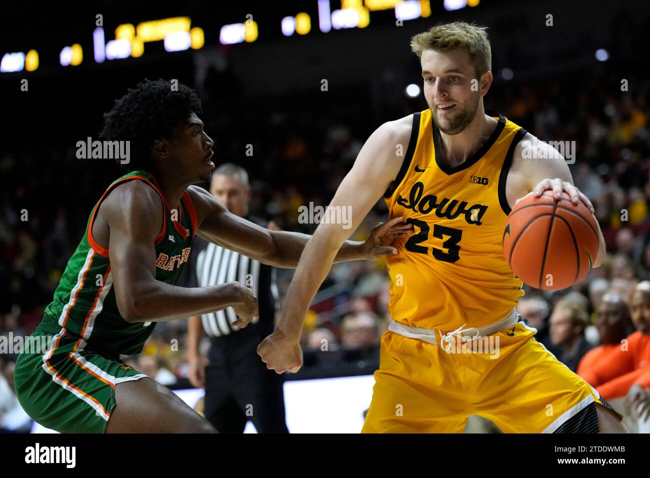 Iowa forward Ben Krikke (23) drives past Florida A&M guard Jordan ...