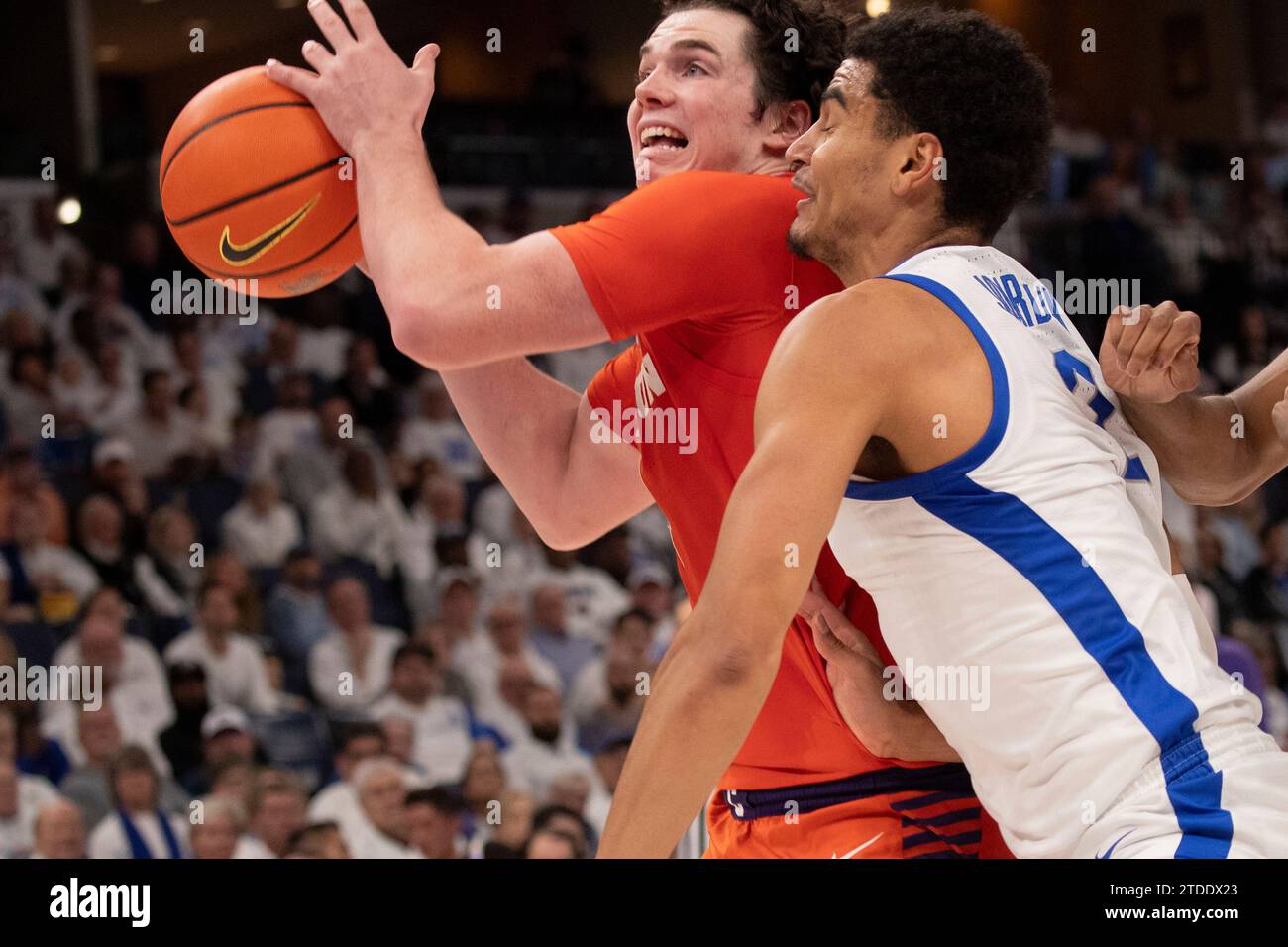 Clemson forward Ian Schieffelin (4) drives to the basket defended by ...