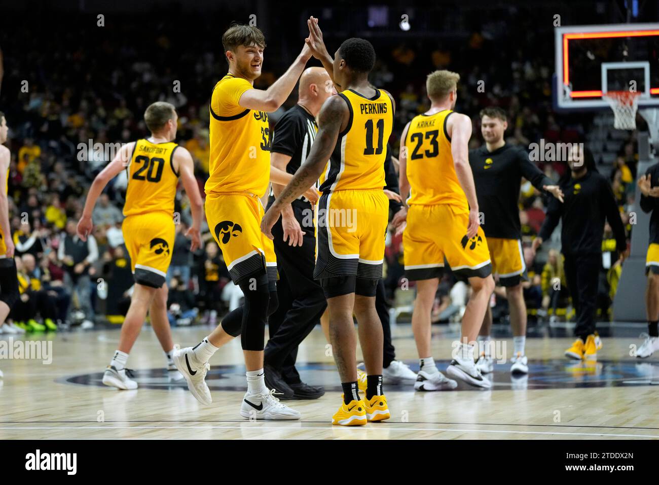 Iowa forward Owen Freeman (32) celebrates with teammate guard Tony ...