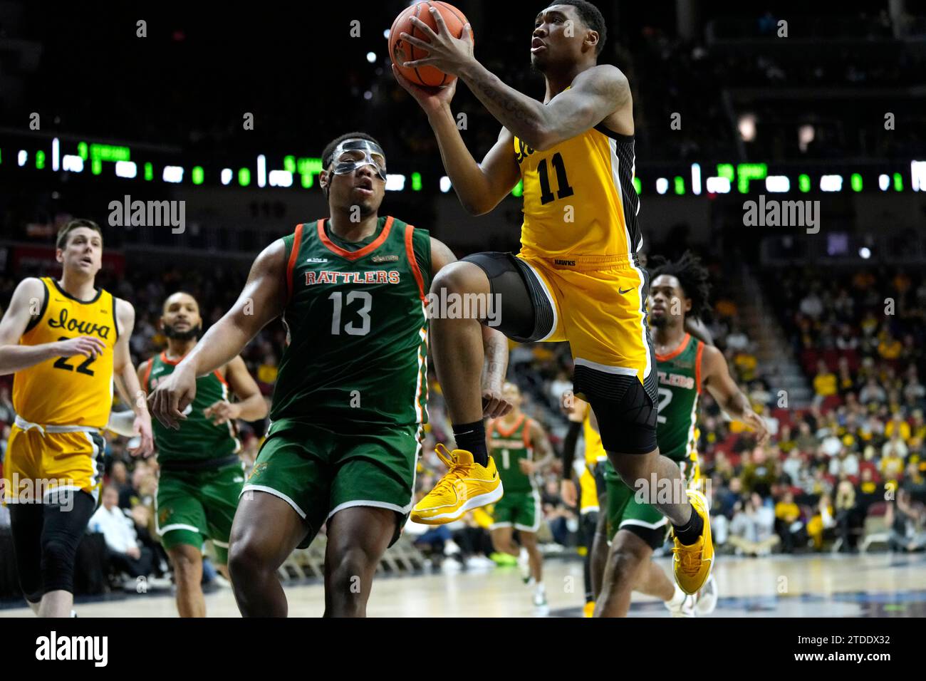 Iowa guard Tony Perkins (11) drives to the basket past Florida A&M ...