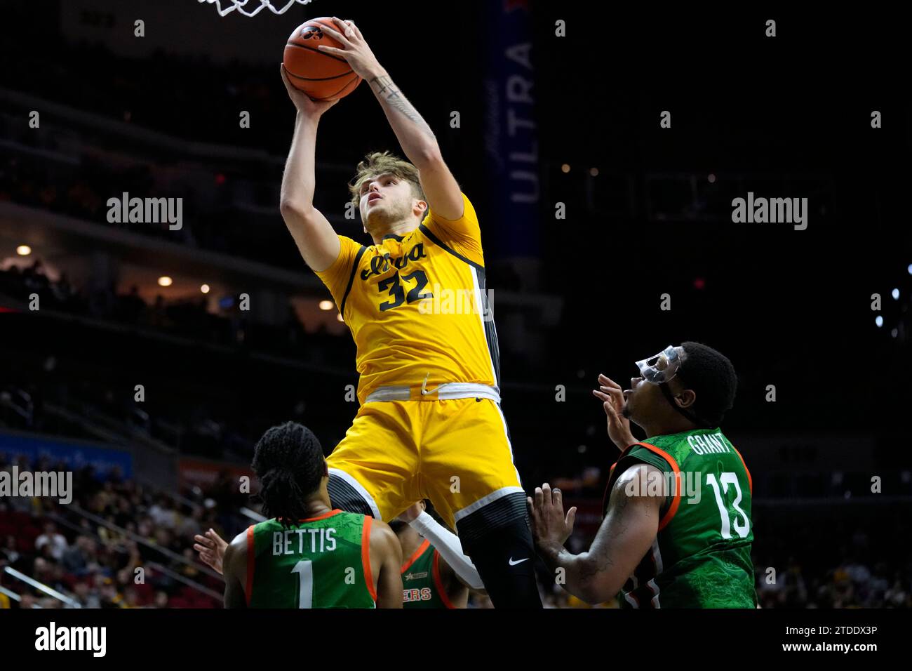 Iowa forward Owen Freeman (32) shoots over Florida A&M guard Love ...