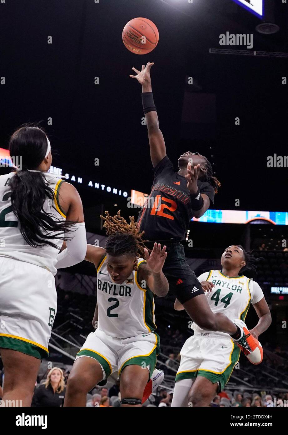 Miami guard Ja'Leah Williams (12) shoots over Baylor guard Yaya Felder ...