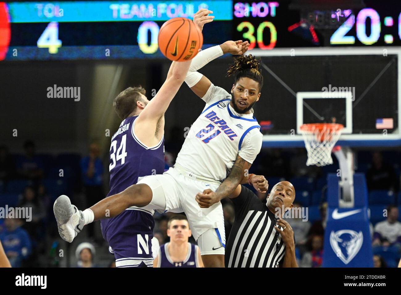 Northwestern center Matthew Nicholson (34) and DePaul forward Da'Sean ...