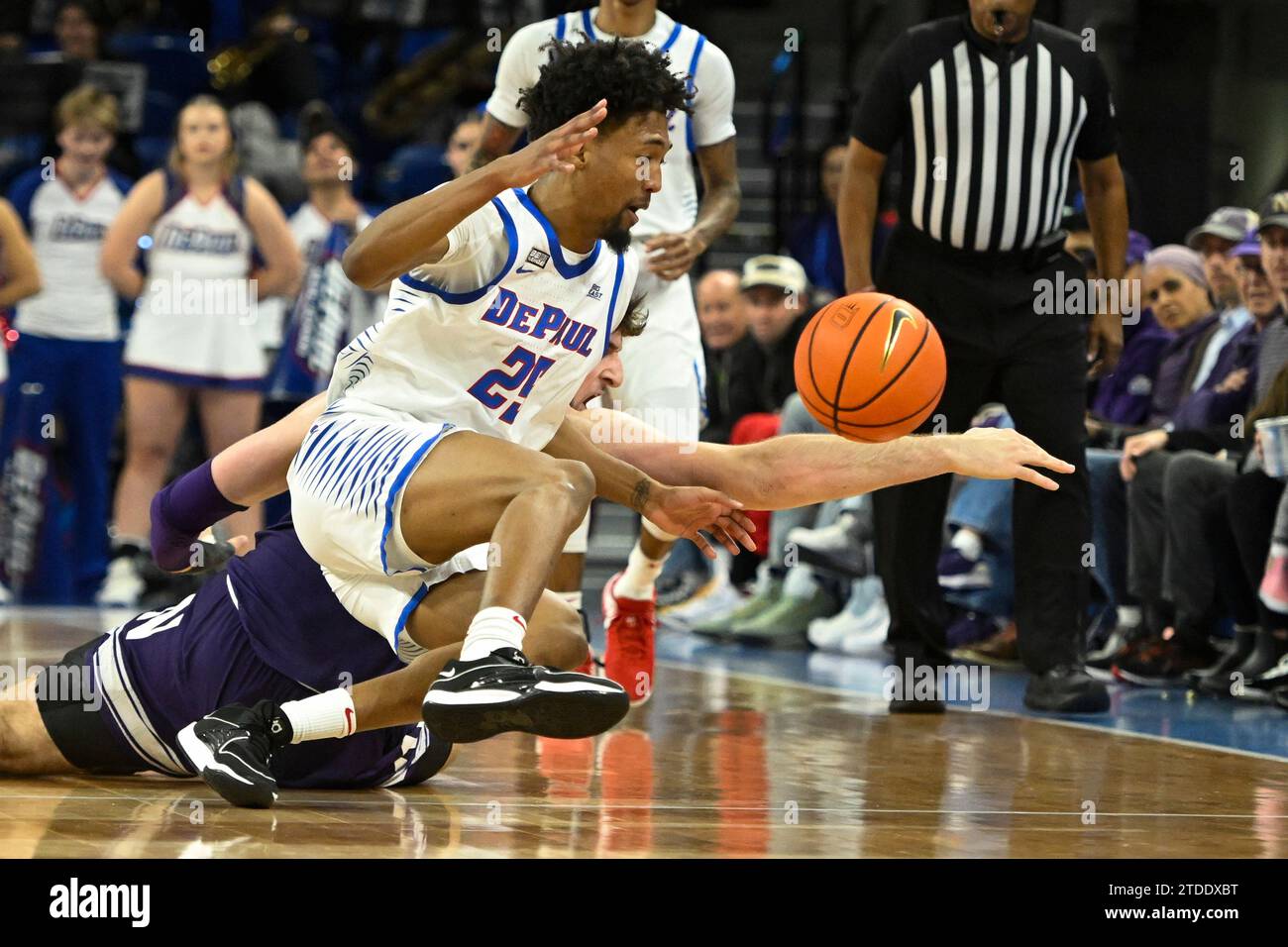 DePaul forward Jeremiah Oden (25) and Northwestern center Matthew ...
