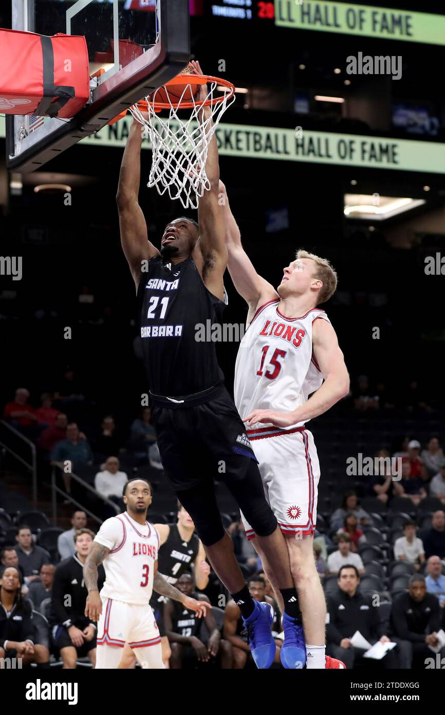 PHOENIX, AZ - DECEMBER 16: UC Santa Barbara Gauchos forward Yohan Traore #21 and Loyola ...