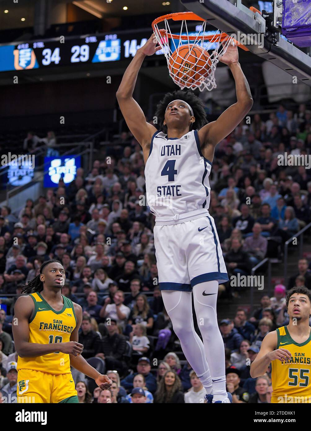 Utah State guard Ian Martinez (4) dunks as San Francisco forward ...