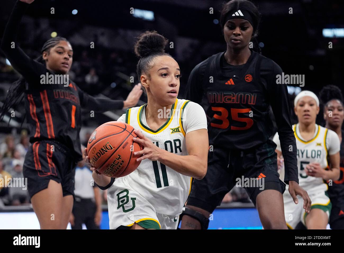 Baylor guard Jada Walker (11) drives around Miami forward Latasha ...