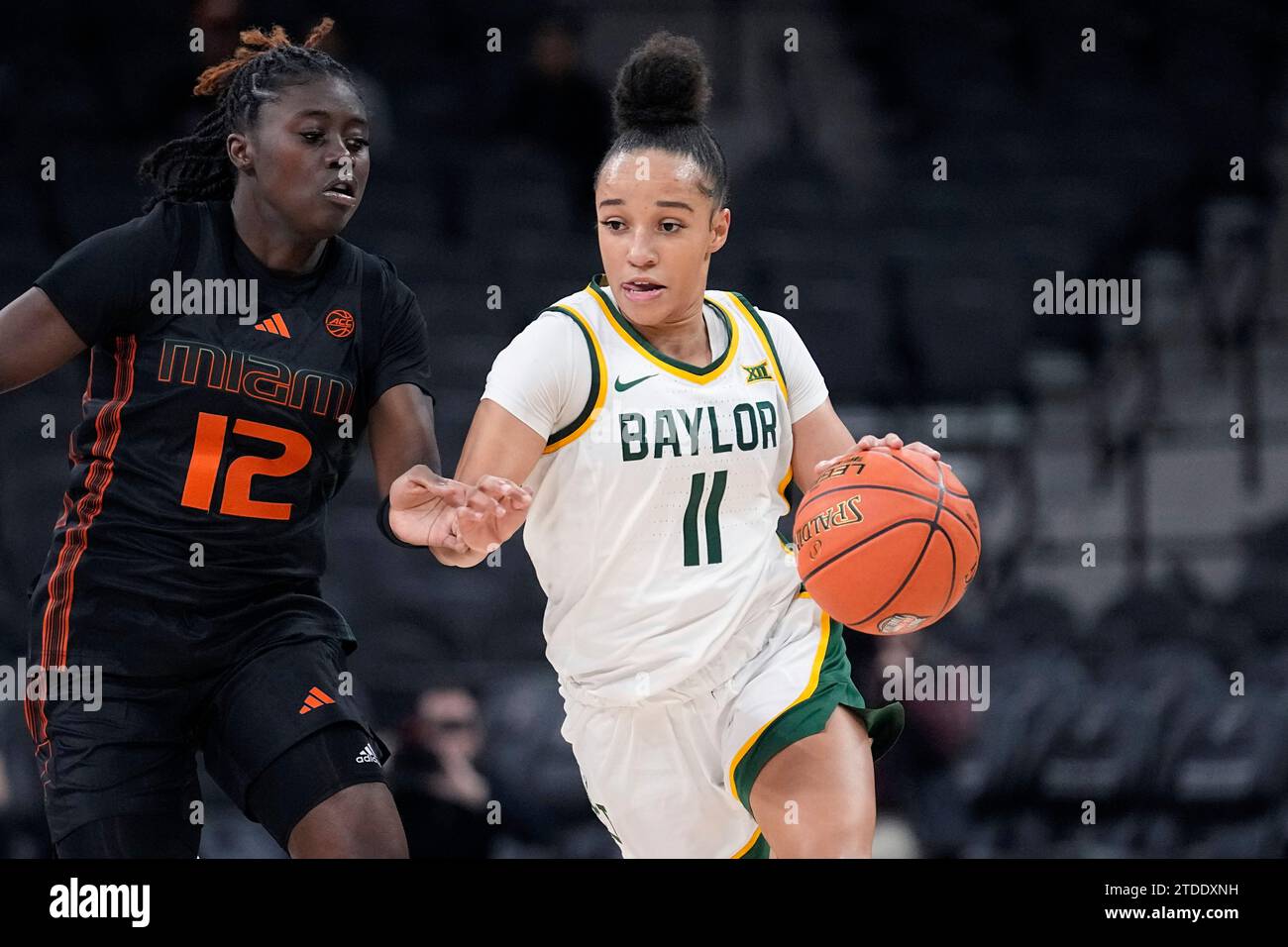 Baylor guard Jada Walker (11) drives around Miami guard Ja'Leah ...