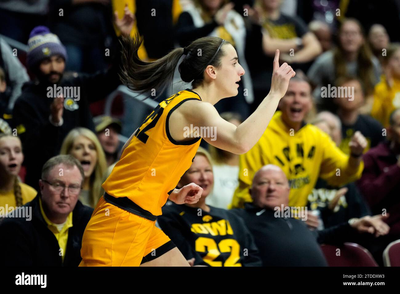 Iowa guard Caitlin Clark reacts after making a basket during the first ...