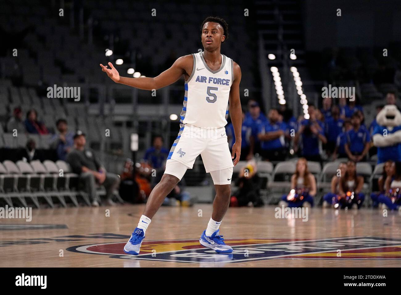 Air Force guard Ethan Taylor (5) celebrates after sinking a 3-point ...