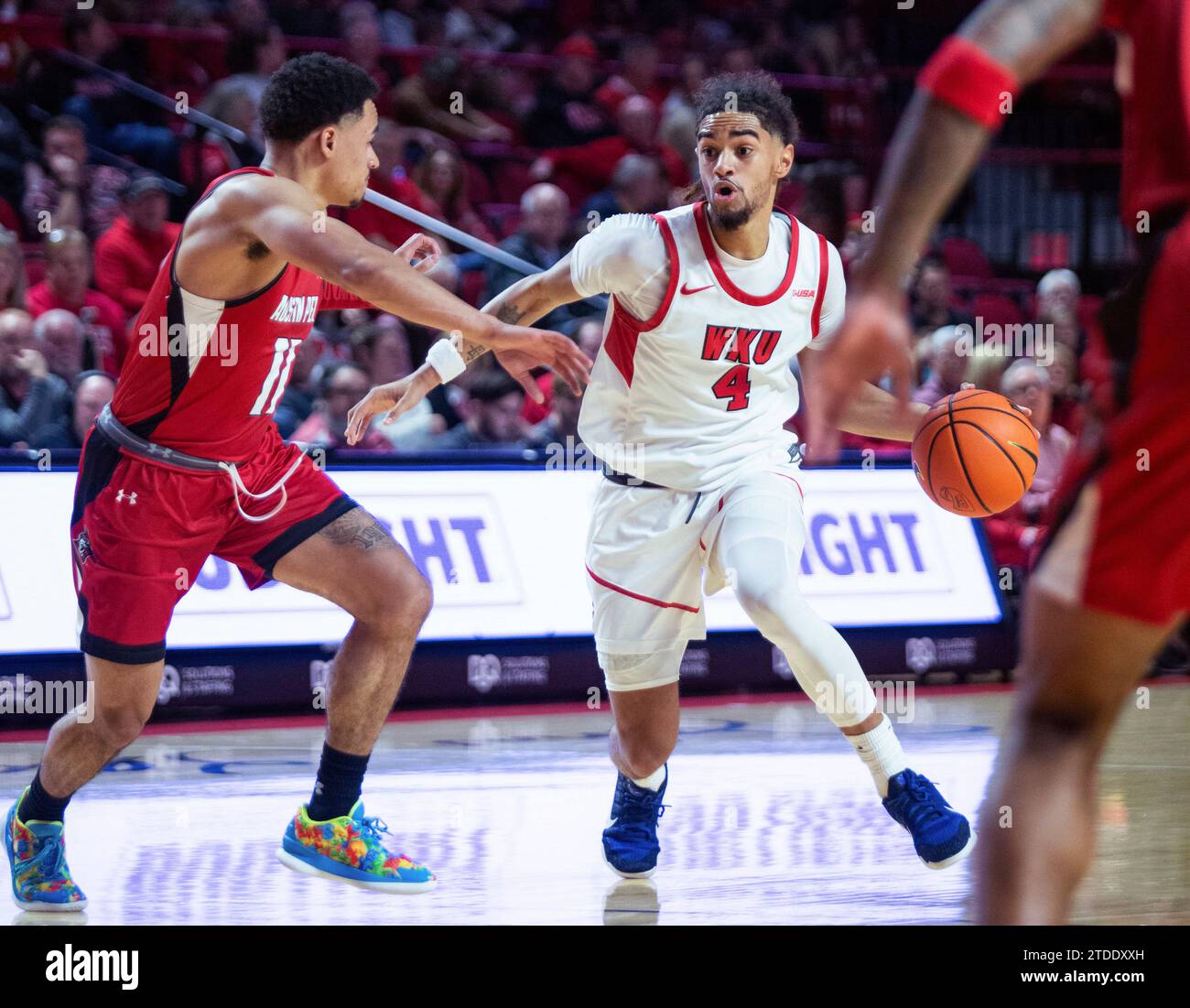 Western Kentucky guard Khristian Lander (4) drives against Austin Peay ...