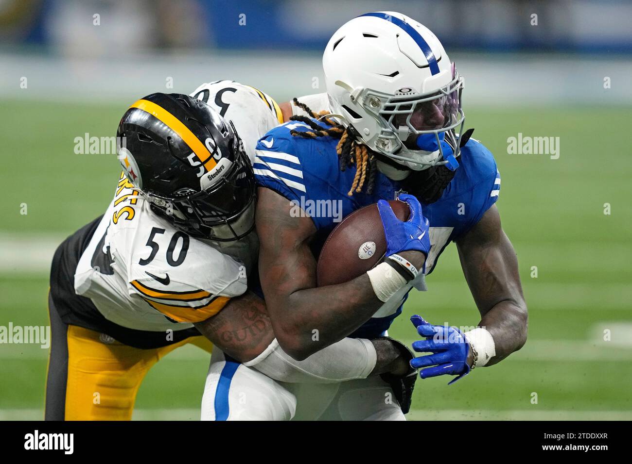 Indianapolis Colts running back Trey Sermon (27) is tackled by ...