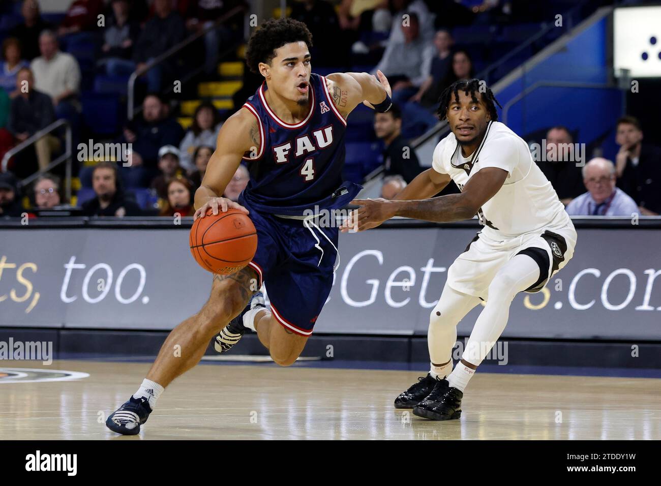 Florida Atlantic's Bryan Greenlee (4) drives past St. Bonaventure's ...