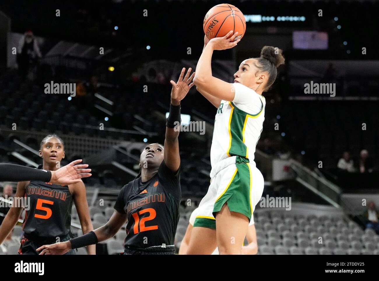 Baylor guard Jada Walker, right, shoots a basket over Miami guard Ja ...