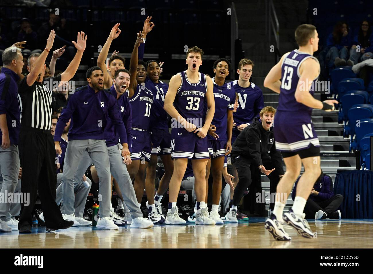 Members of the Northwestern team yell after guard Brooks Barnhizer ...
