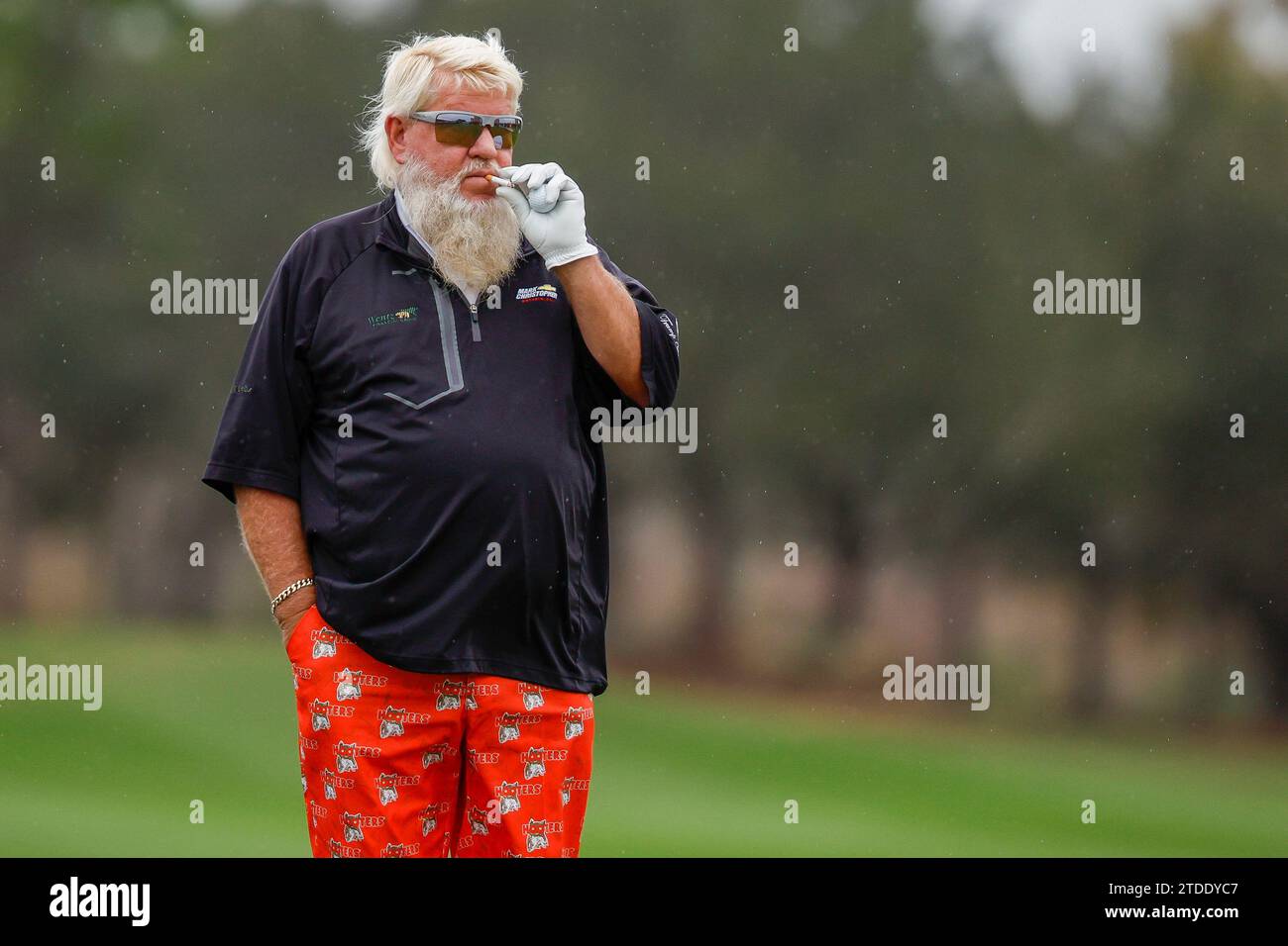December 16, 2023: John Daly smoking a cigarette during Round One of ...