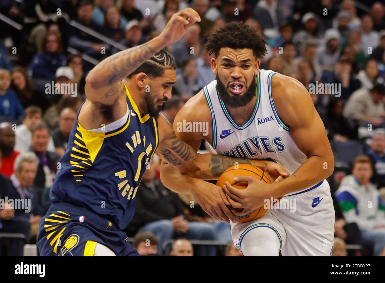 Minnesota Timberwolves forward Karl-Anthony Towns, right, tries to work ...