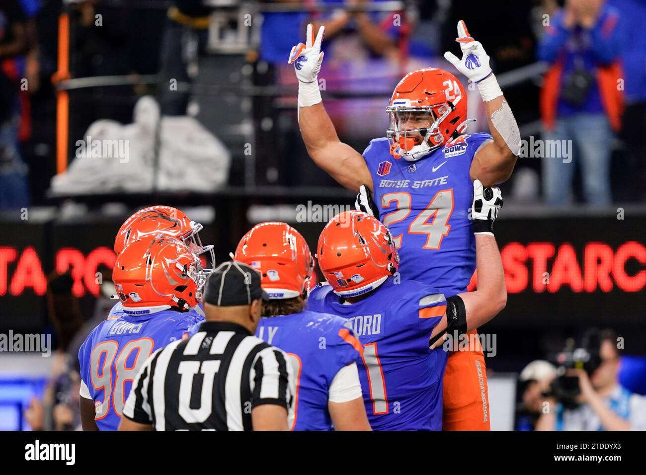 Boise State running back George Holani (24) is lifted by offensive ...