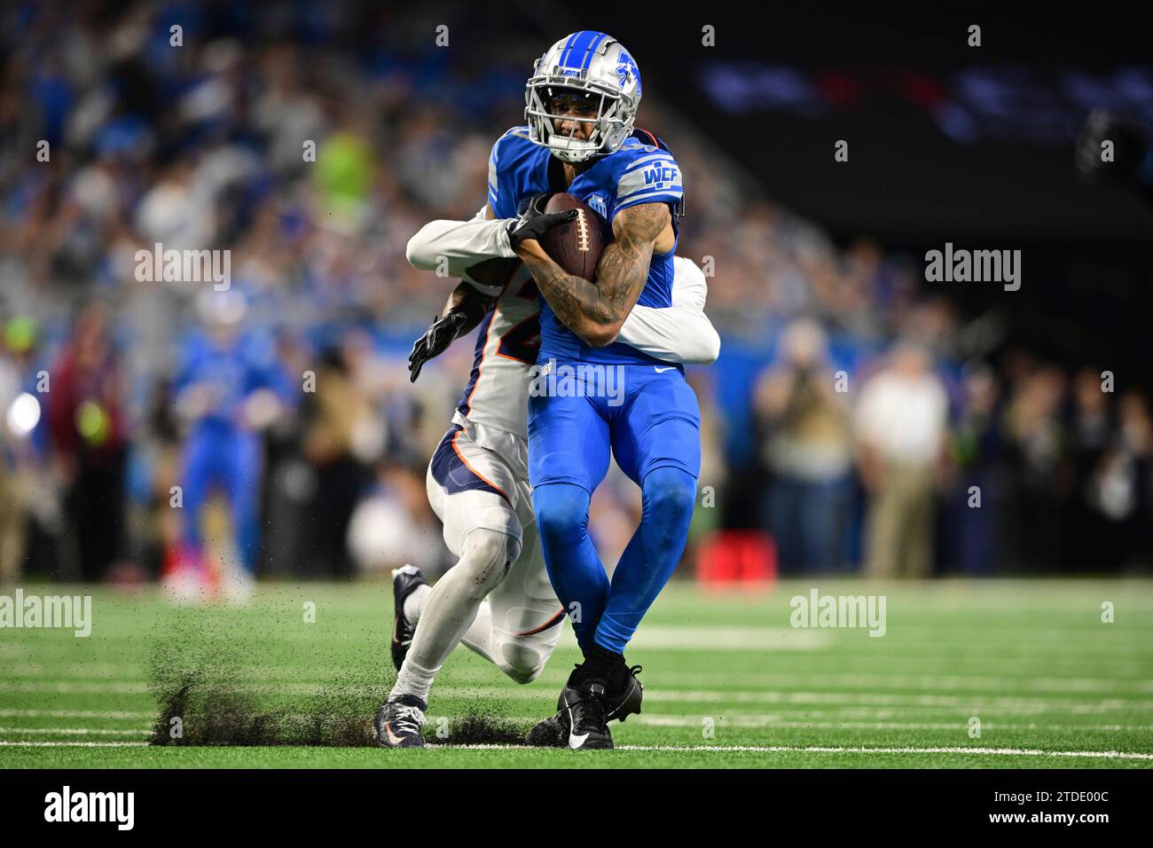 Detroit Lions wide receiver Josh Reynolds (8) is tackled by Denver ...