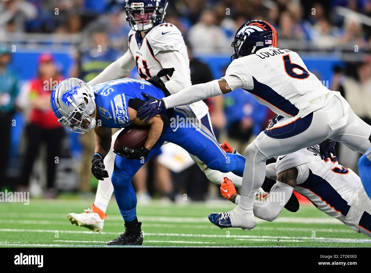 Denver Broncos safety P.J. Locke (6) reaches in on Detroit Lions wide ...