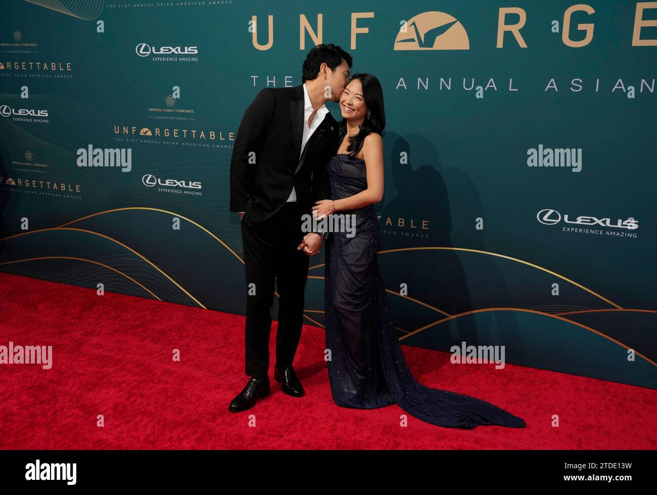 Host Simu Liu, left, kisses his girlfriend Allison Hsu on the red ...