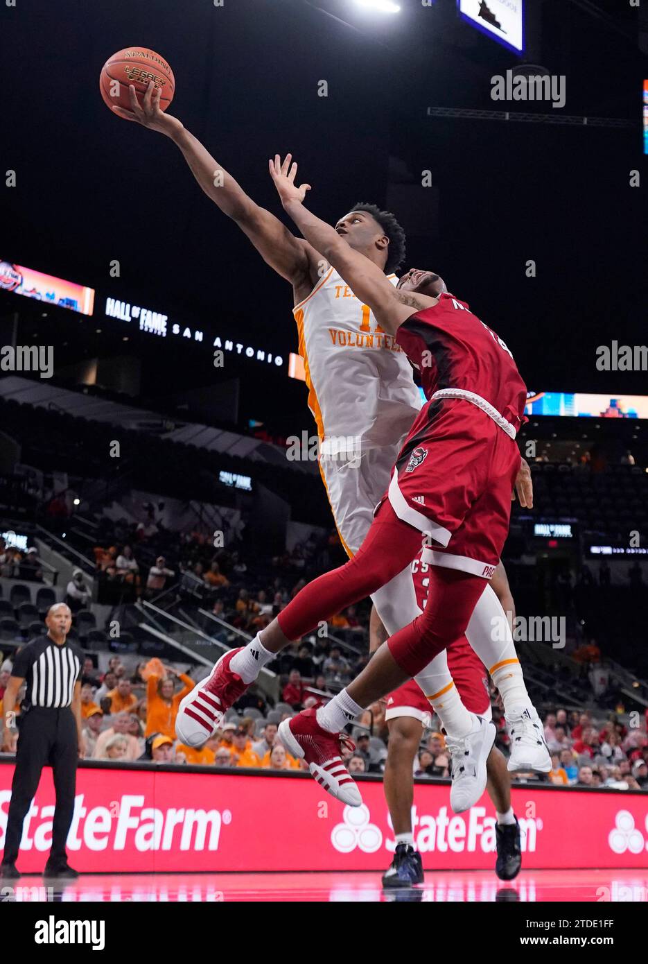 Tennessee forward Tobe Awaka (11) and North Carolina State guard Casey ...