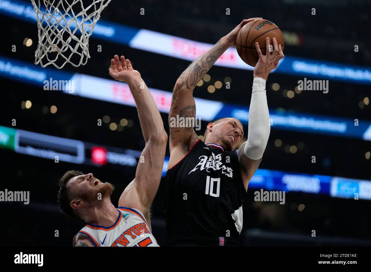 Los Angeles Clippers center Daniel Theis (10) gets a rebound ahead of ...