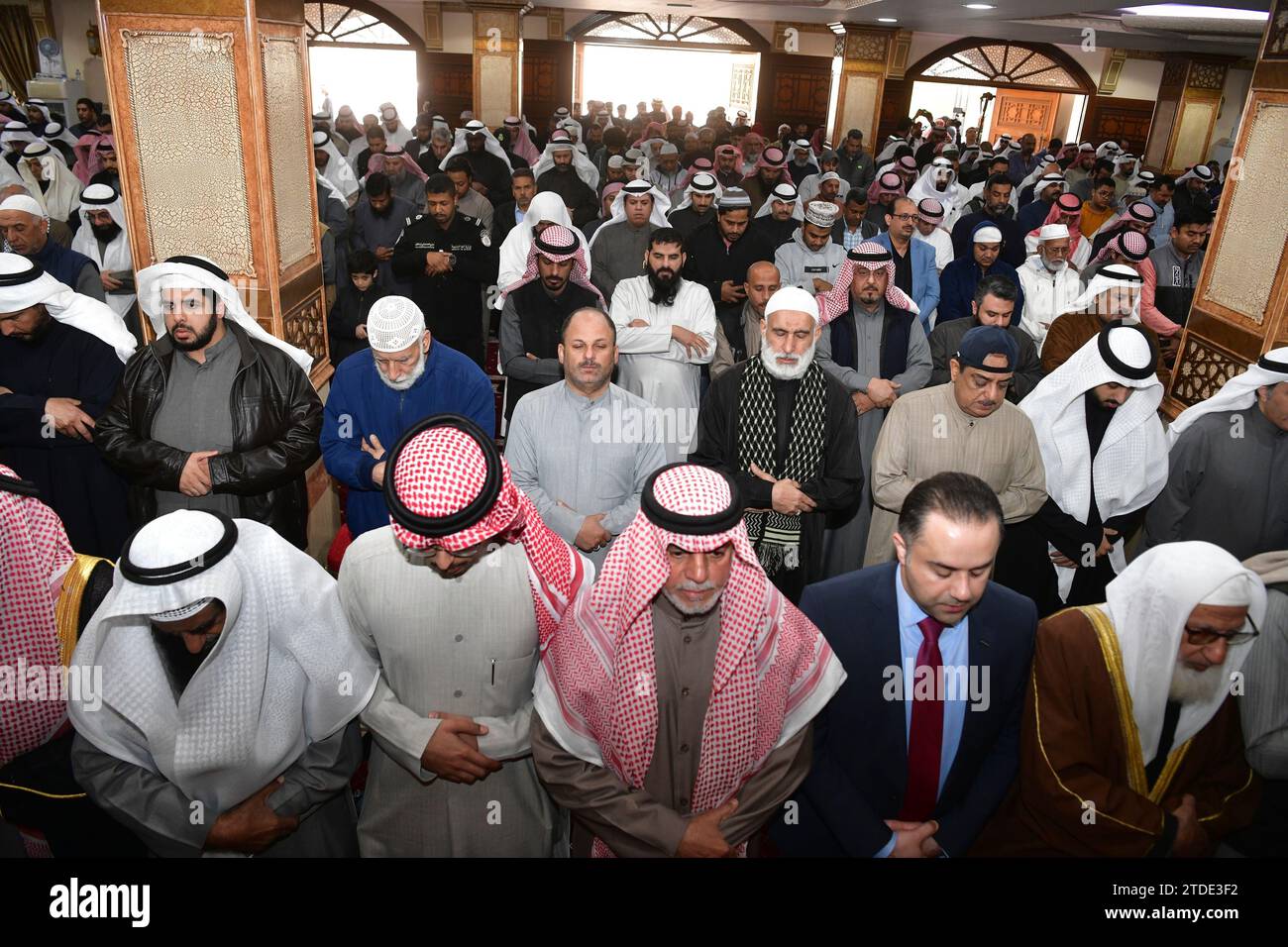 People pray during the funeral ceremony of the Emir of Kuwait Sheikh ...