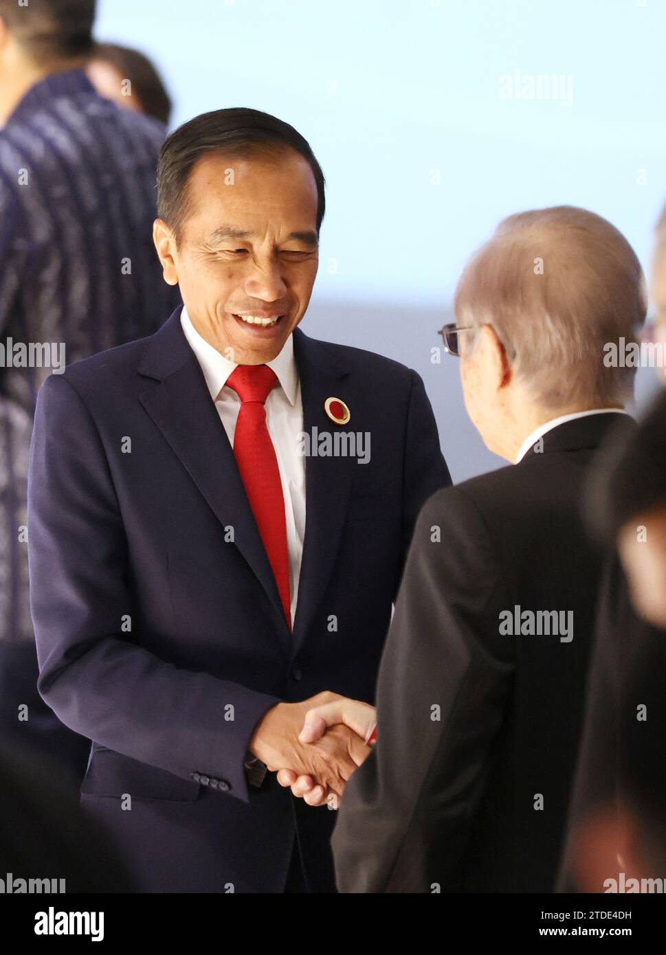 Indonesian President Hoko Eidodo, left, shakes hands with former ...