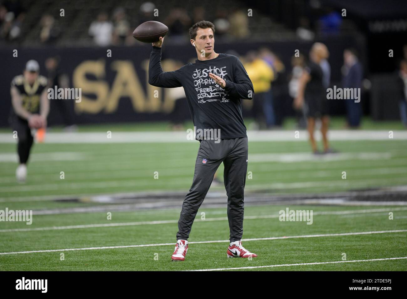 New York Giants quarterback Tommy DeVito warms up before the start of an NFL football game ...
