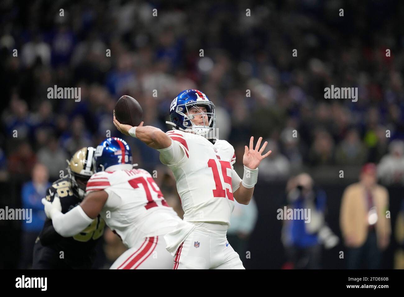 New York Giants quarterback Tommy DeVito throws during the first half of an NFL football game ...