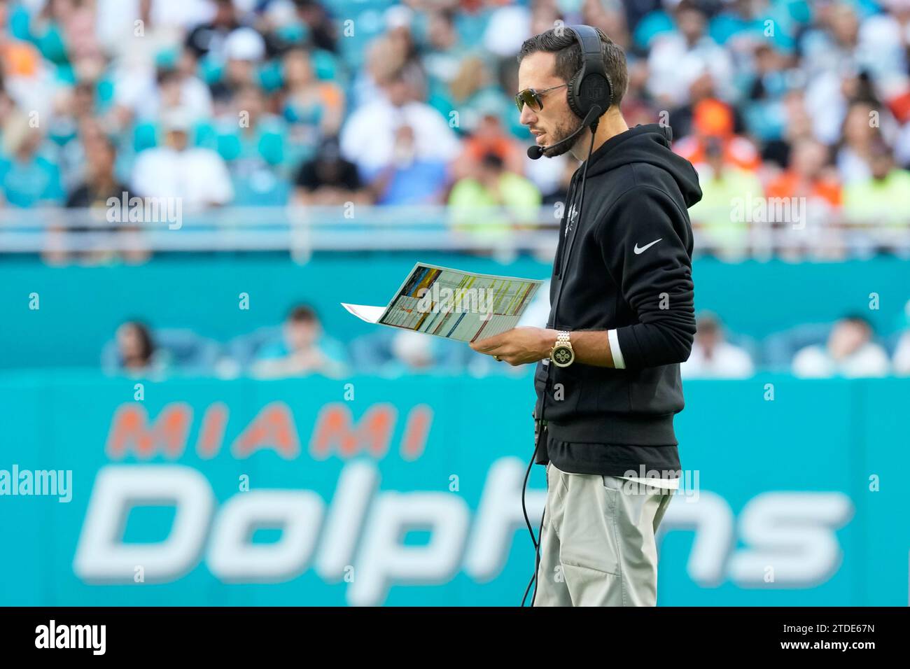 Miami Dolphins head coach Mike McDaniel stands on the field during the first half of an NFL ...
