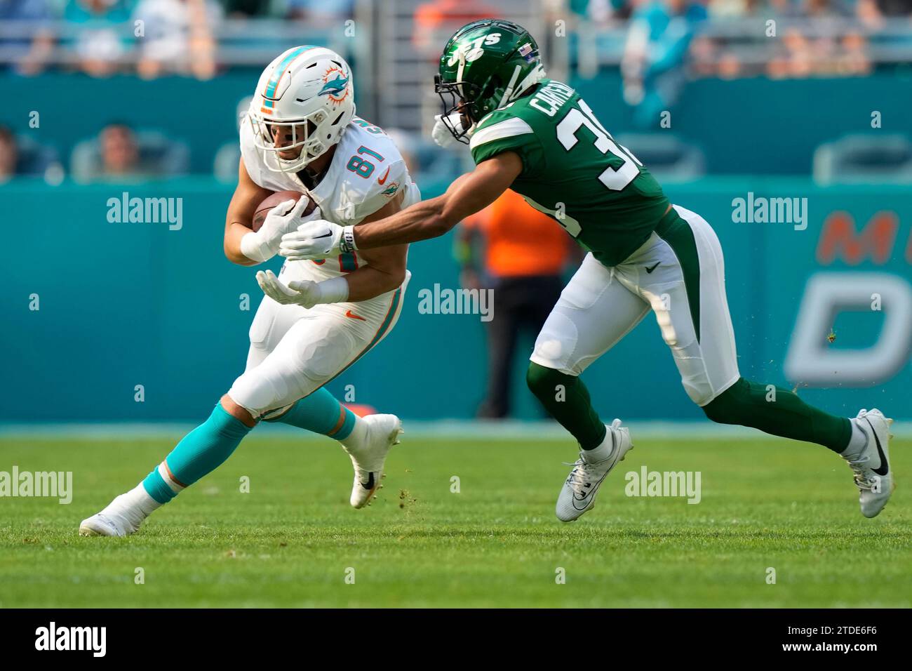 New York Jets cornerback Michael Carter II (30) goes after Miami ...