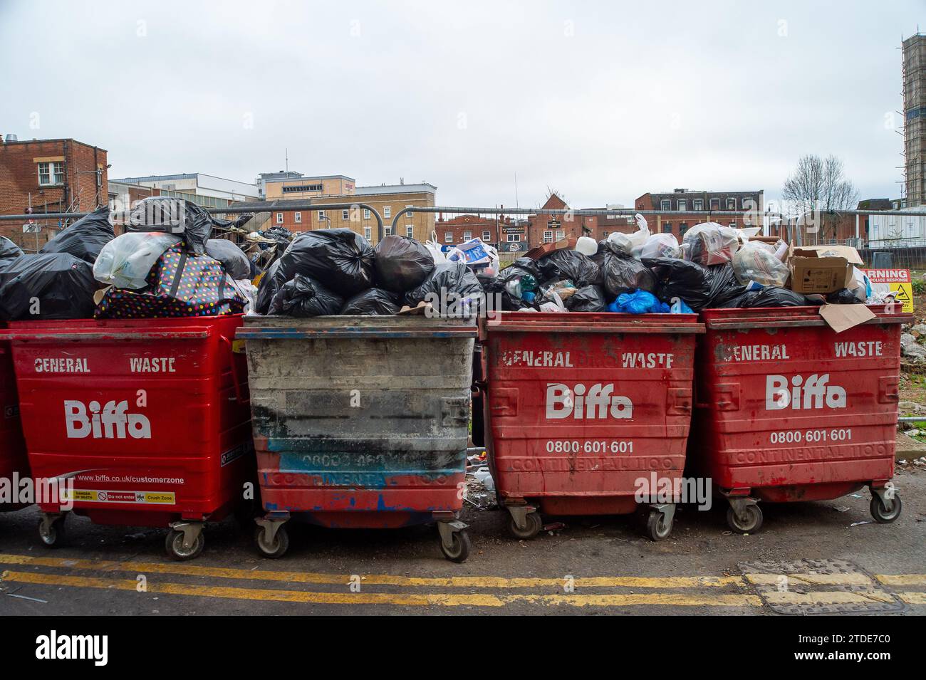 Slough, Berkshire, UK. 16th December, 2023. Overflowing bins outside a ...