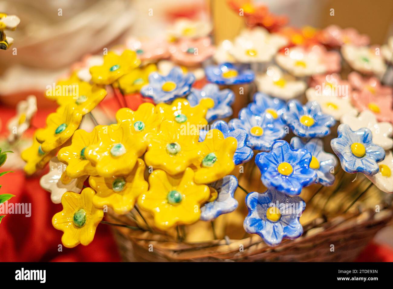 porcelain stars and flowers in different colors inside a basket Stock ...