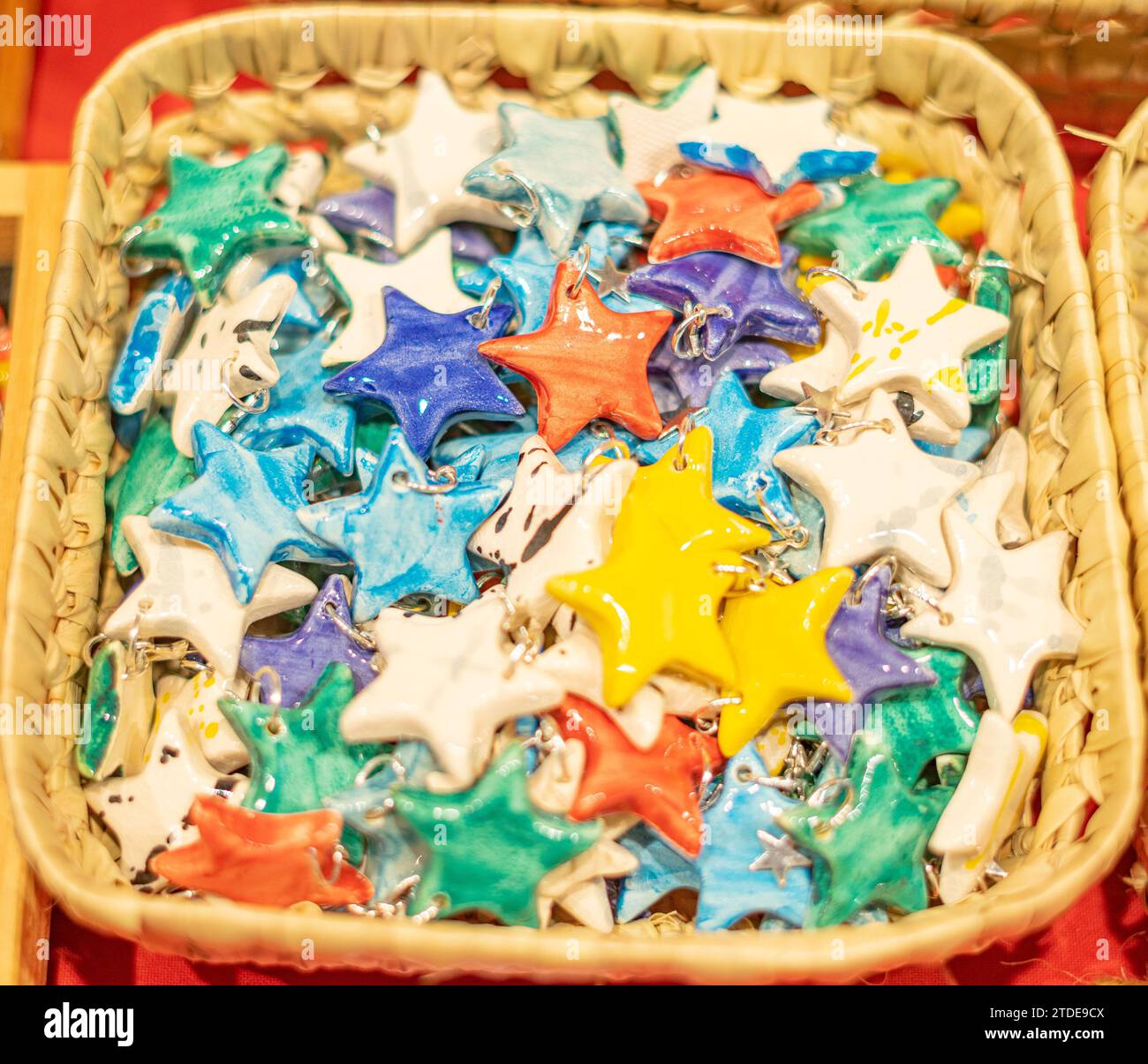 porcelain stars and flowers in different colors inside a basket Stock ...