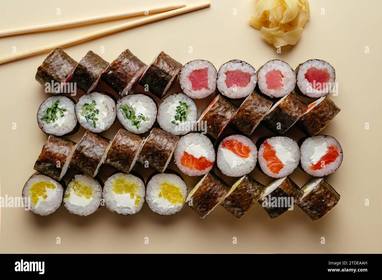 Japanese sushi set on a colored background Stock Photo - Alamy