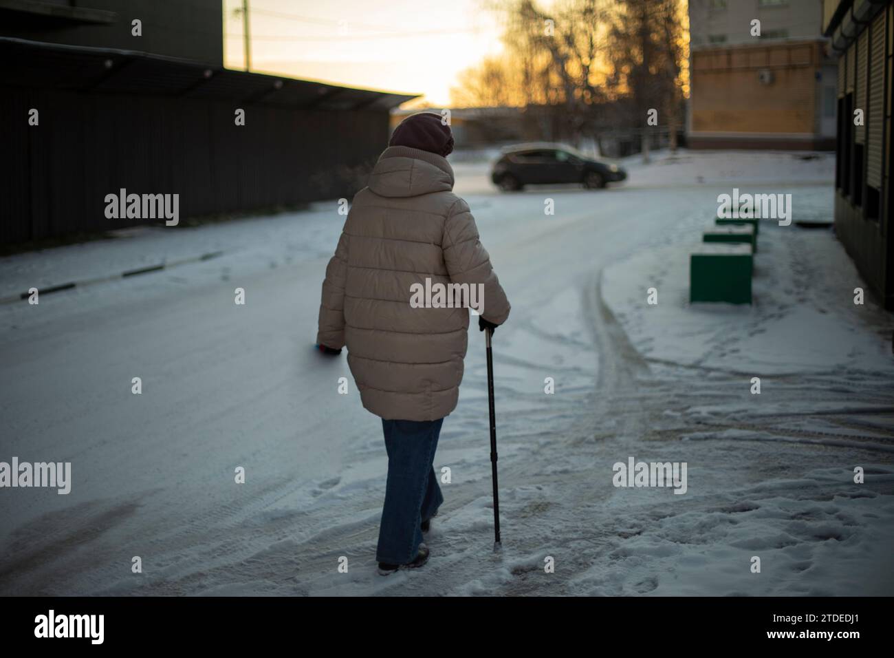 A woman with a support stick when walking Stock Photo - Alamy