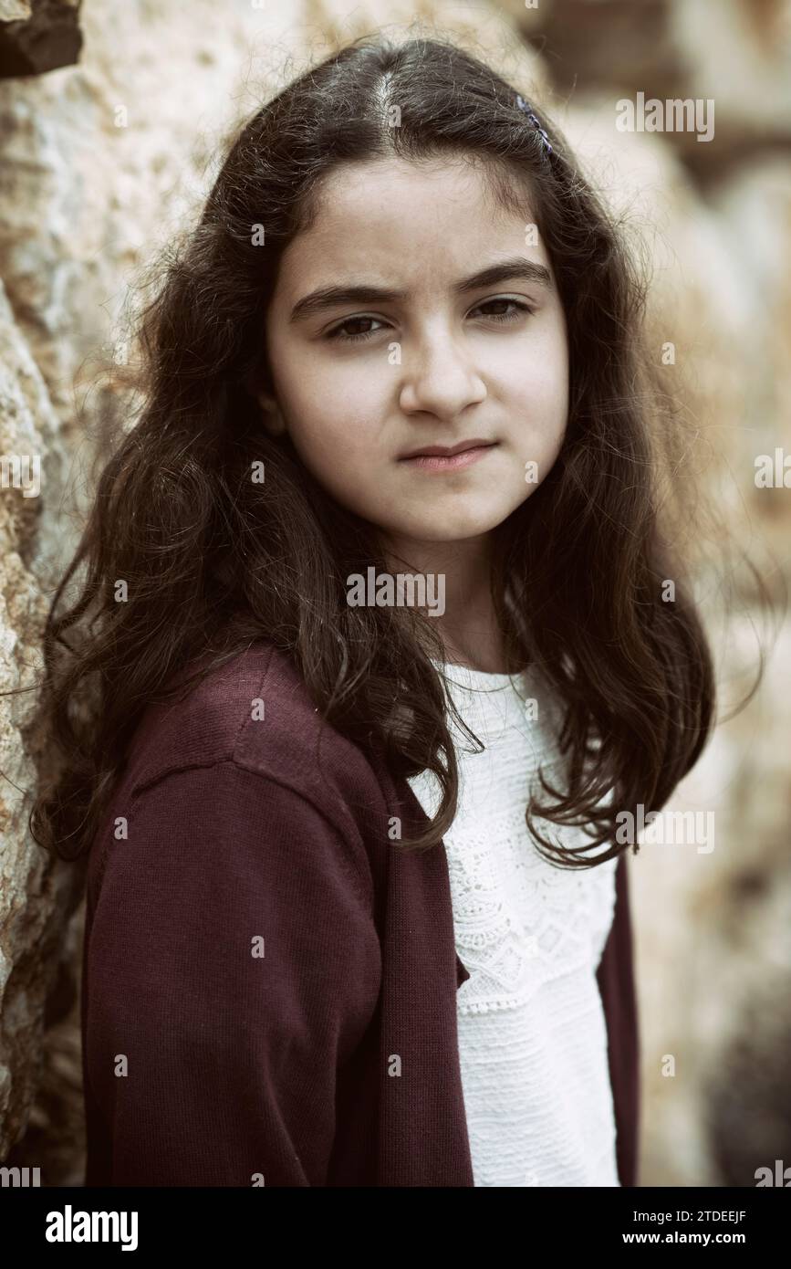 Beautiful sad girl looking at camera outdoors Stock Photo - Alamy