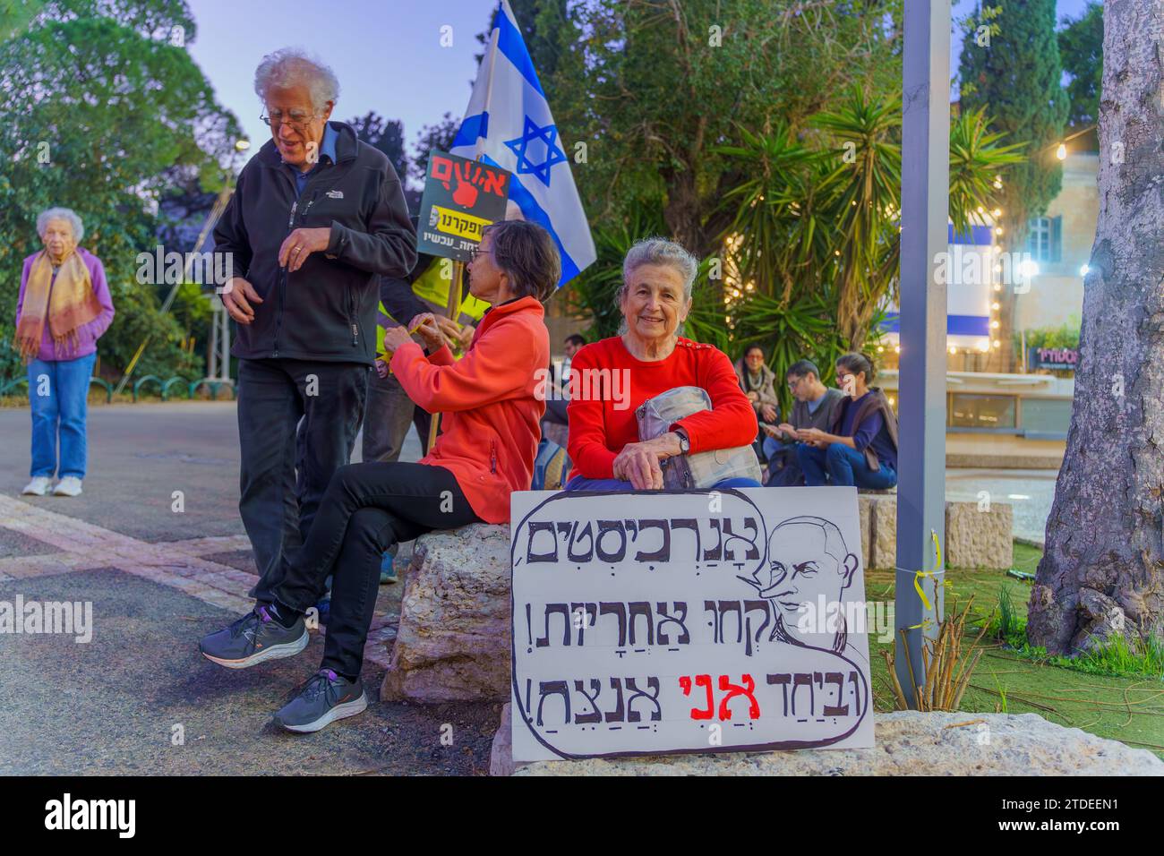 Haifa, Israel - December 16, 2023: People with various signs protesting ...
