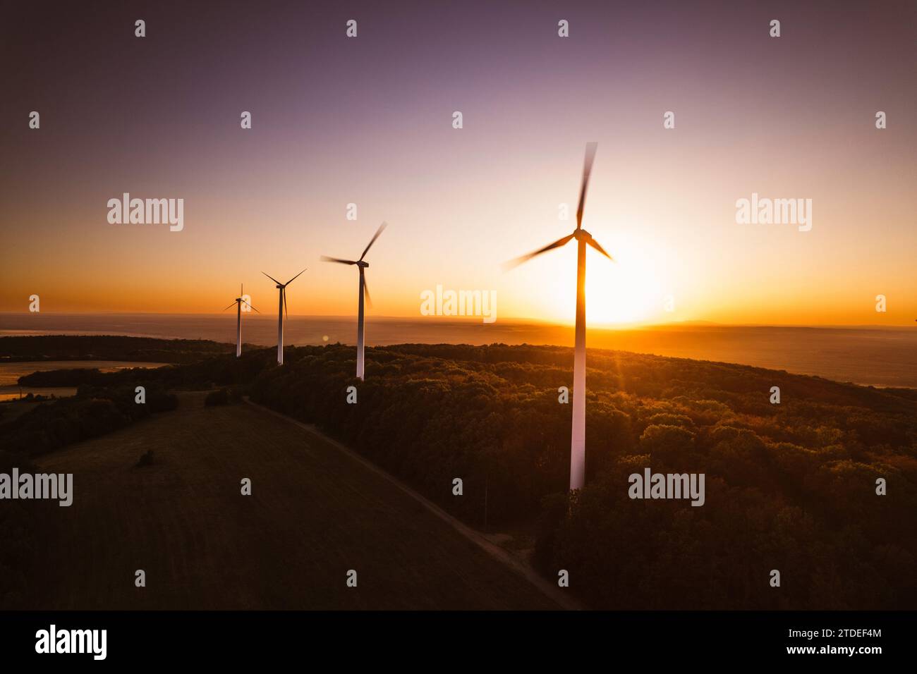 Aerial landscape photography of sunrise over nature with wind turbines ...