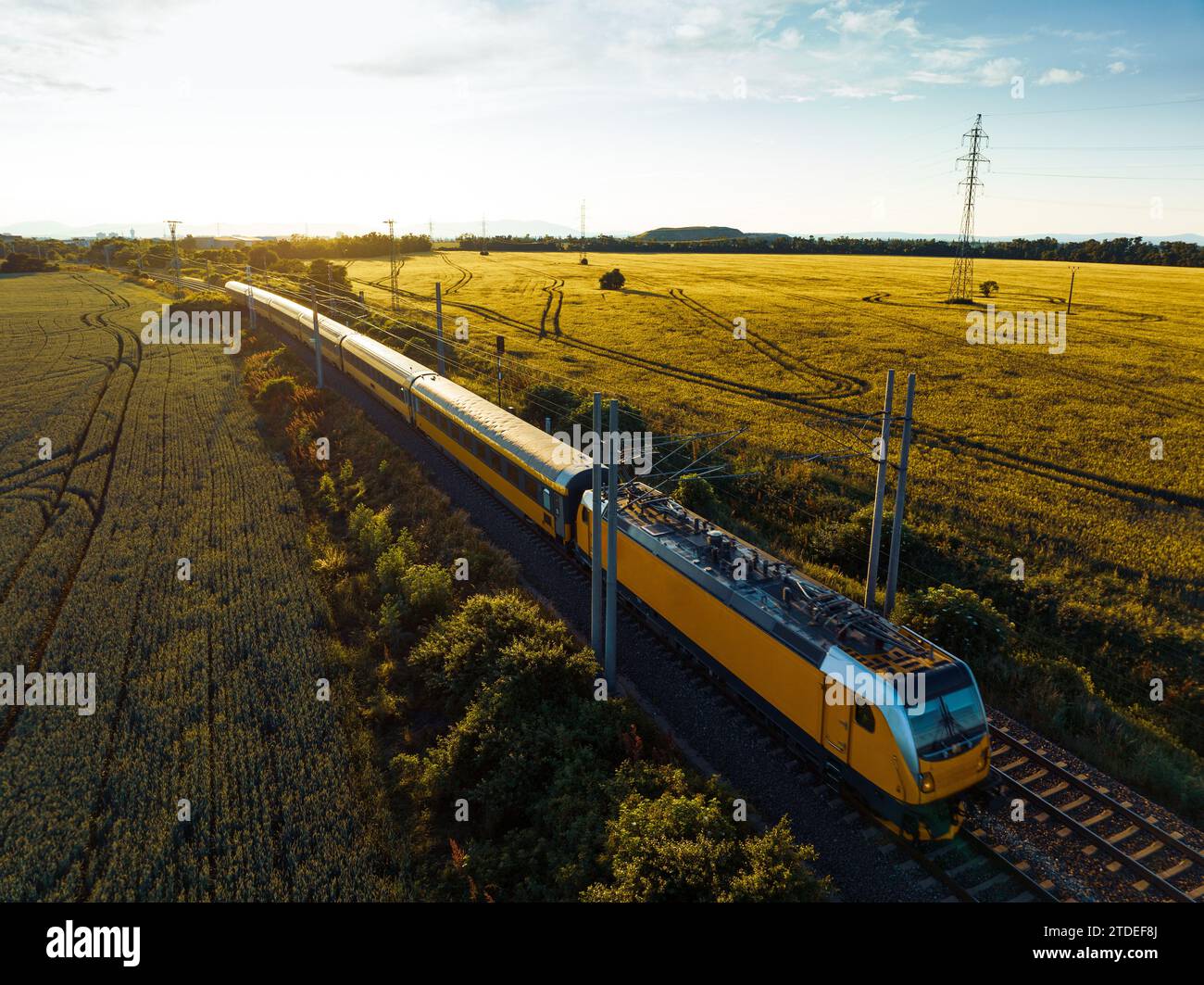 Aerial view of train in the middle of nature, field, during autumn ...