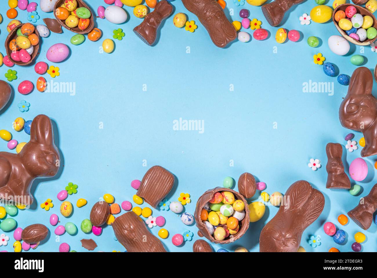 Easter chocolate egg and bunny background. High-colored flat lay with ...