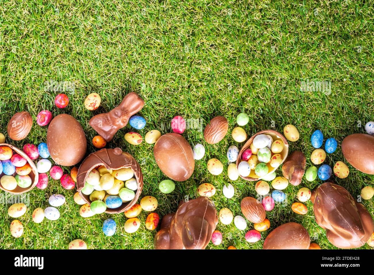 Easter egg hunting background. Various candy and chocolate Easter eggs ...