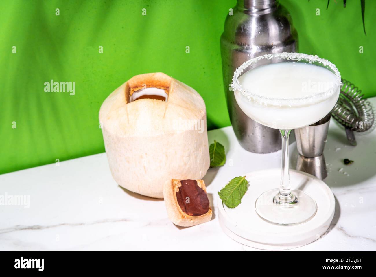 Coconut daiquiri or martini cocktail, with creamy liqueur and young ...