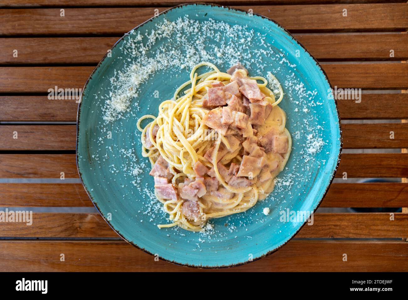 a close up birds eye view over a plate of fresh spaghetti carbonara ...